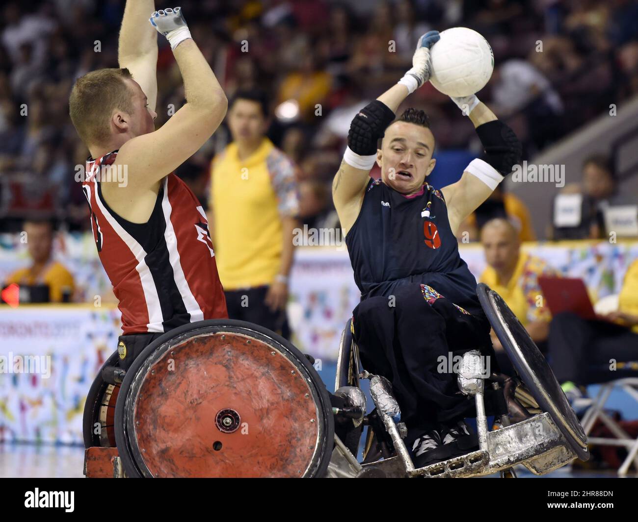 Canada's Zak Madell, left, rams Colombia's Cristian Amaya Fajardo ...
