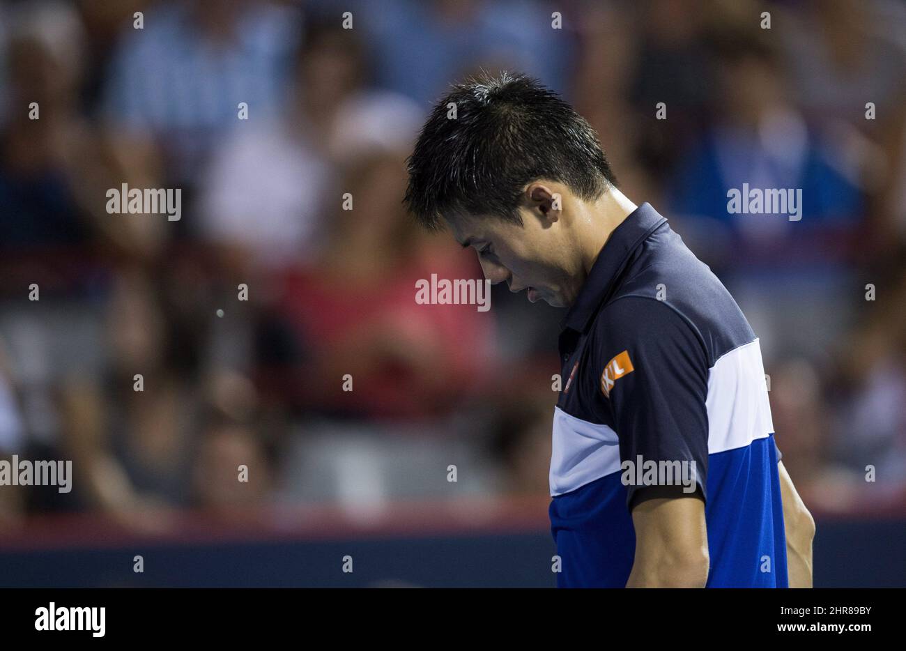 Andy Murray of Great Britain reacts as he faces Kei Nishikori of Japan ...