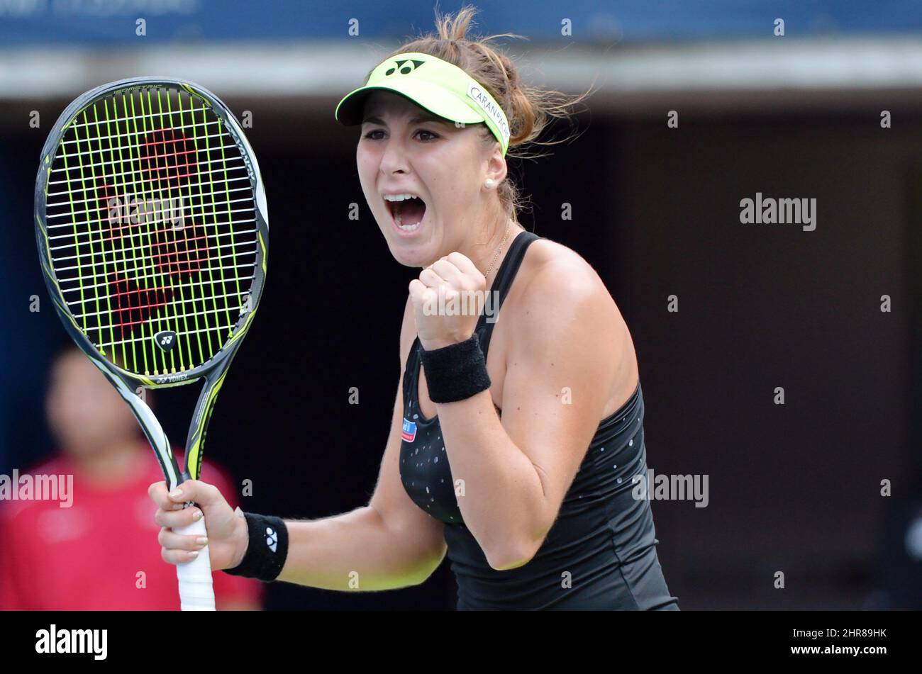 Belinda Bencic, of Switzerland, reacts after winning the first set ...