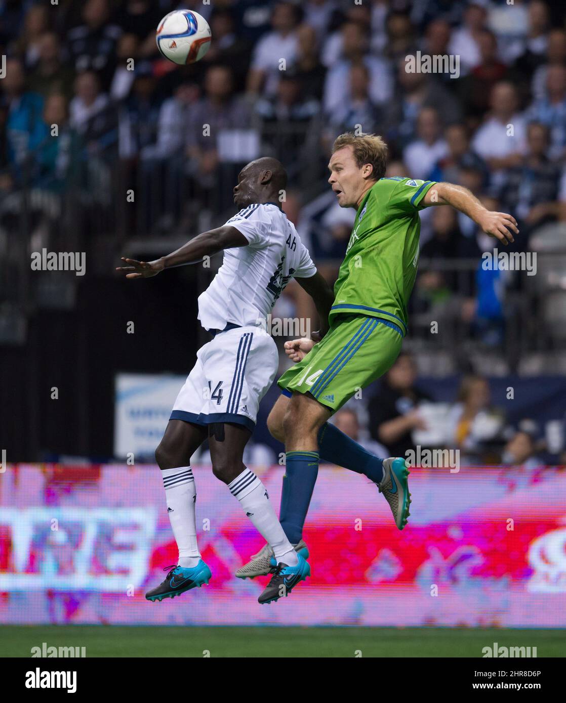 Vancouver Whitecaps' Pa-Modou Kah, left, of Norway, and Seattle ...