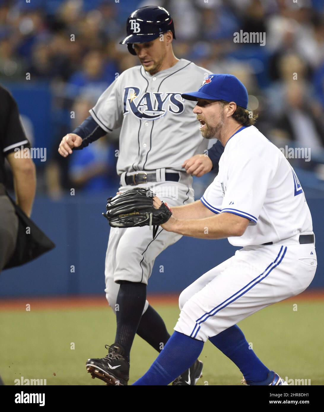 Toronto Blue Jays starting pitcher R.A. Dickey covers home base as ...