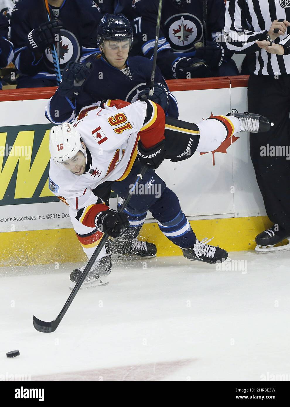 Calgary Flames' Josh Jooris (16) and Winnipeg Jets' J.C. Lipon (46 ...