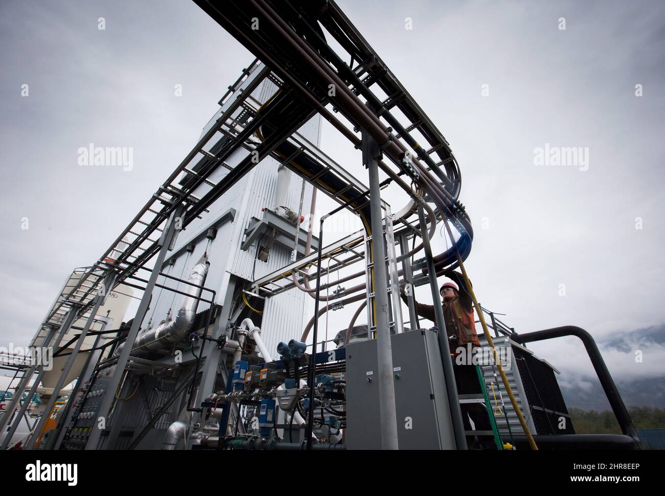 Plumber Sean Mahedy installs a pneumatic line at Calgary-based Carbon ...