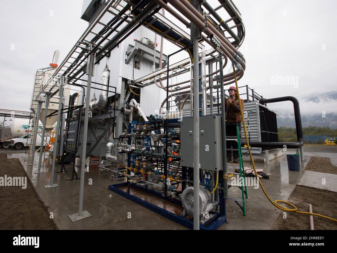 Plumber Sean Mahedy installs a pneumatic line at Calgary-based Carbon ...