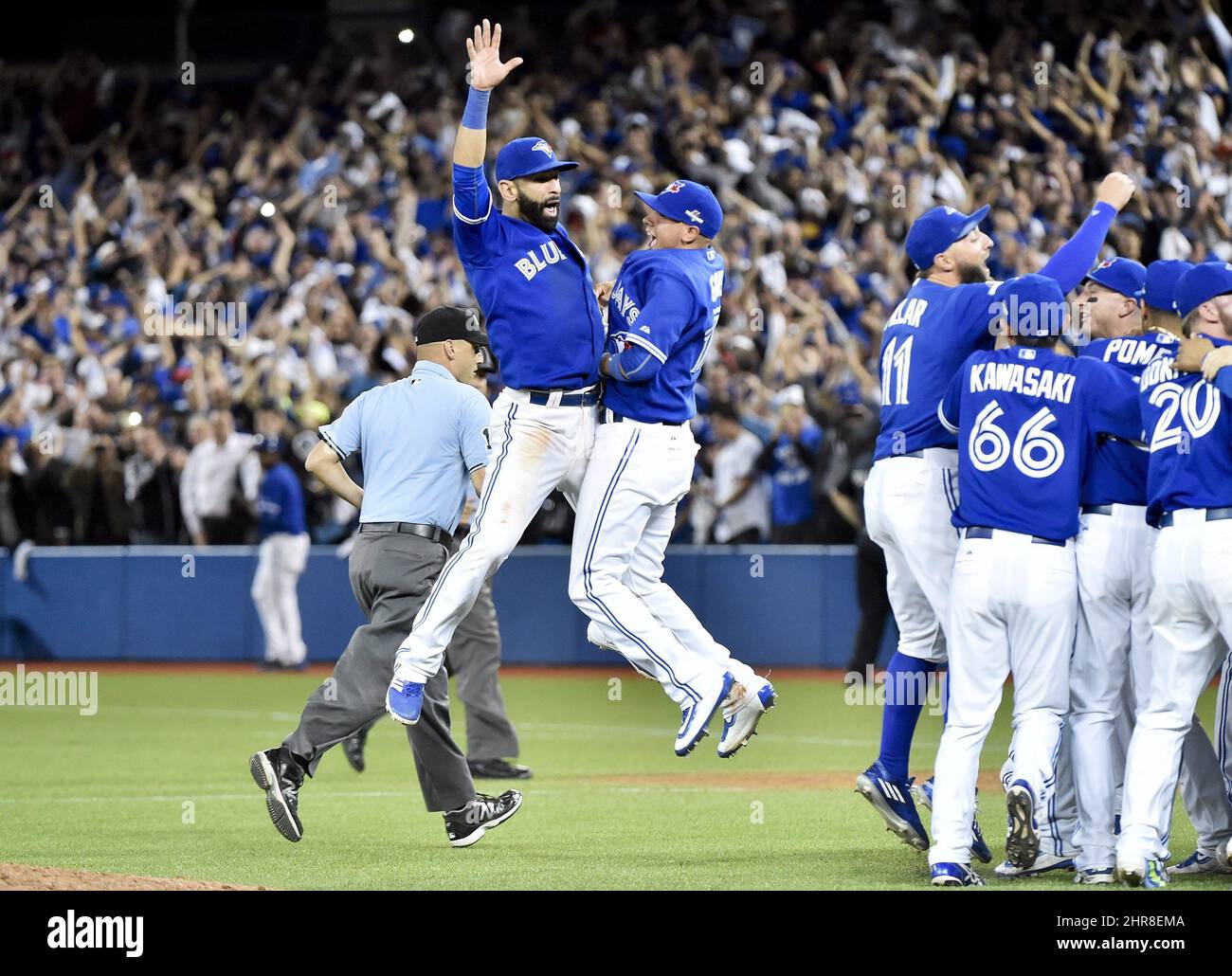 Toronto Blue Jays teammates Jose Bautista, left, and Ryan Goins ...