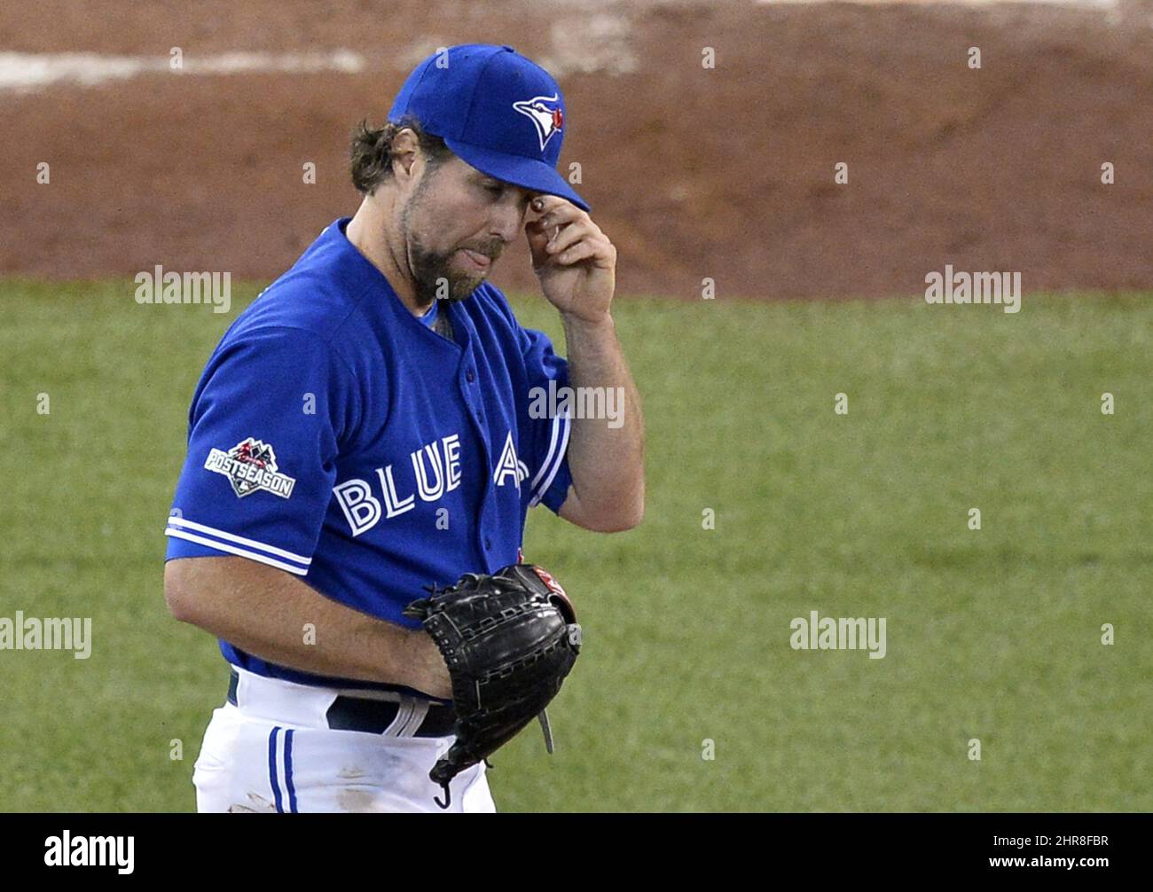 Toronto Blue Jays starting pitcher R.A.Dickey reacts after Kansas City ...
