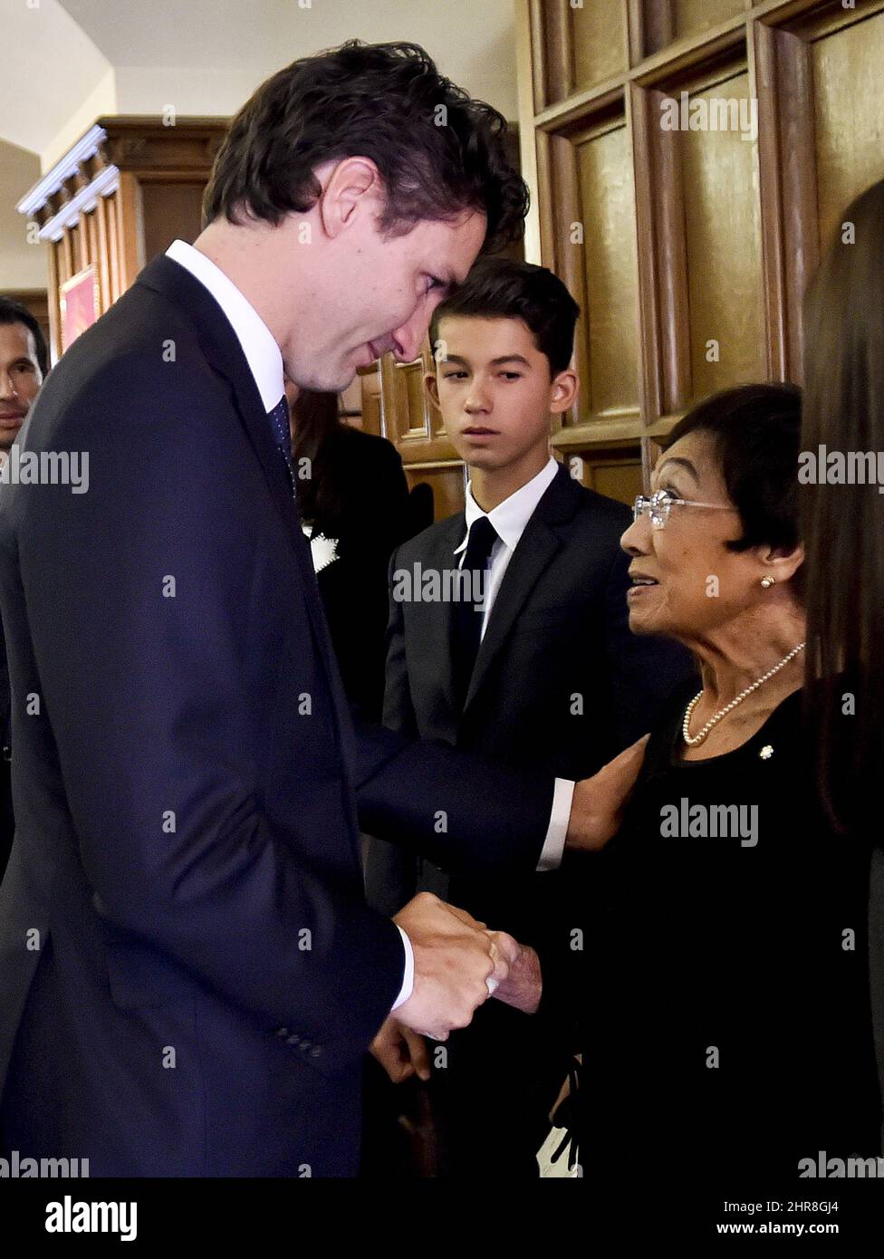 Prime Minister Justin Trudeau, left, pays his respects to widow Pat ...
