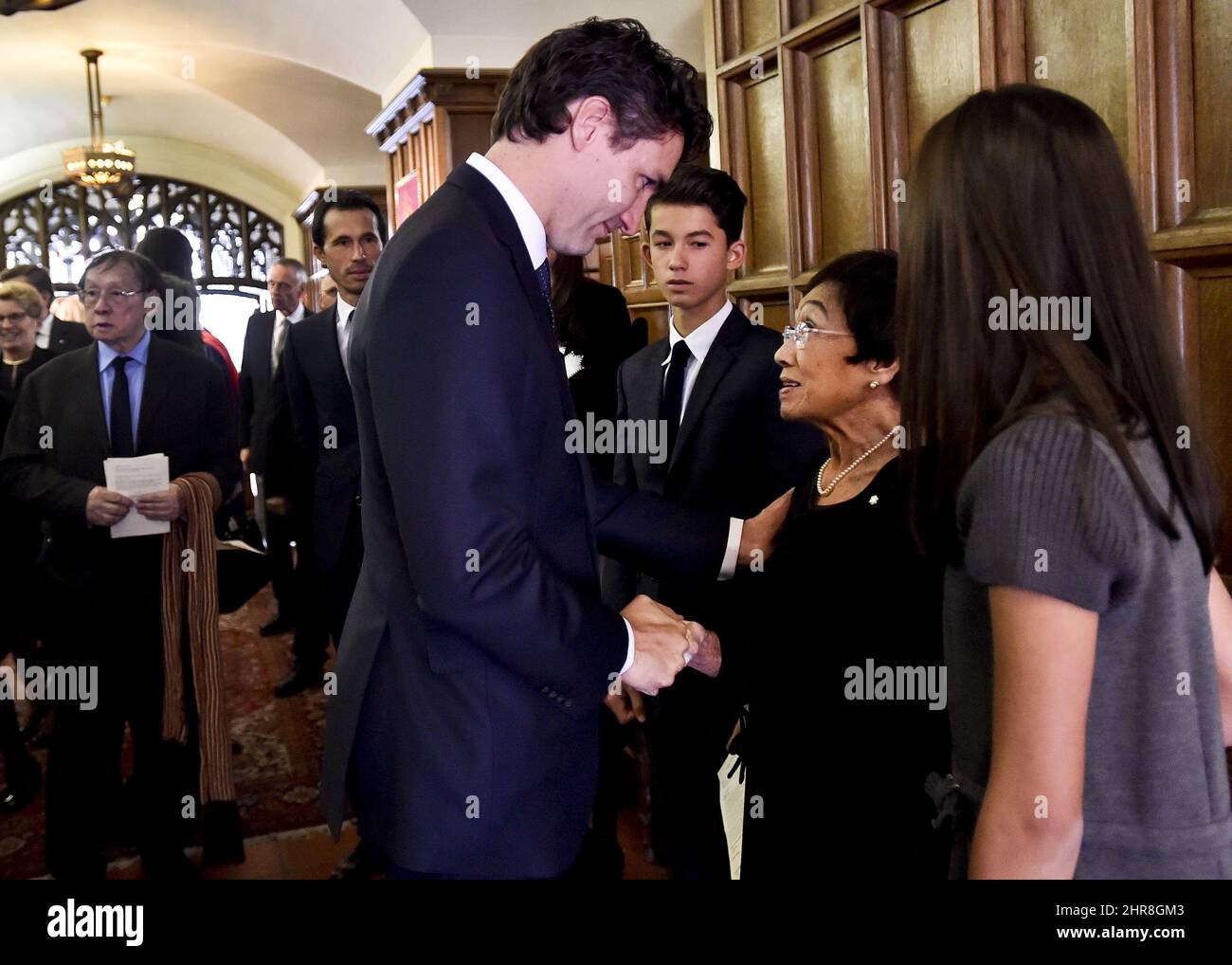 Prime Minister Justin Trudeau, left, pays his respects to widow Pat ...