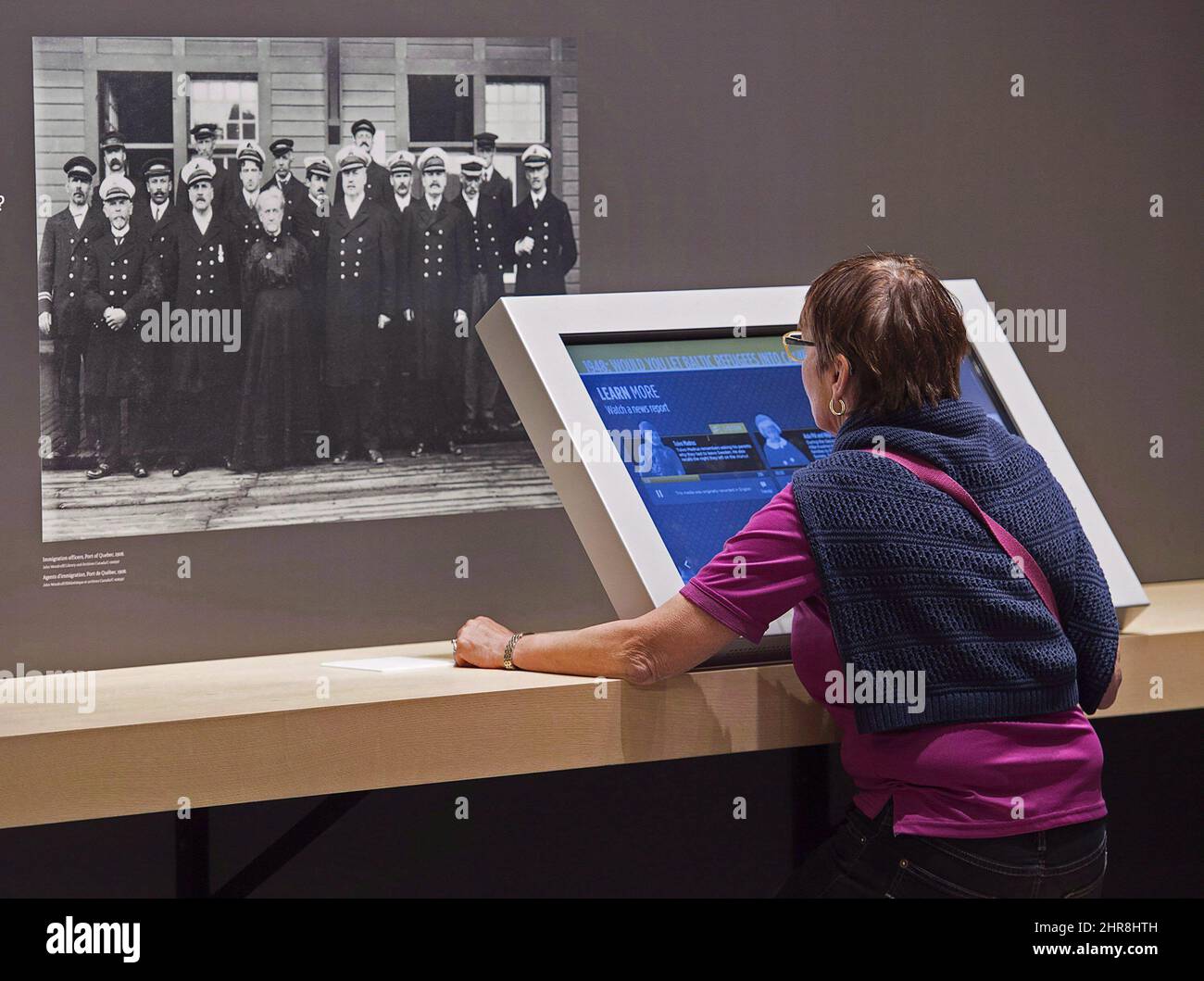 A visitor views an exhibit at the Canadian Museum of Immigration at ...