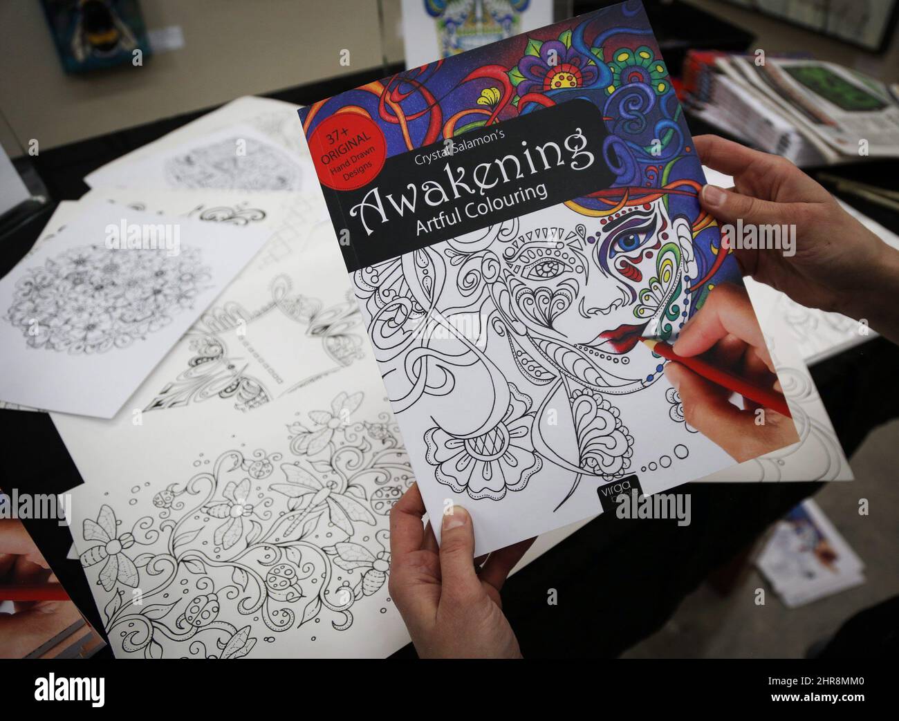 Crystal Salamon, an illustrator and adult colouring book designer, show ...