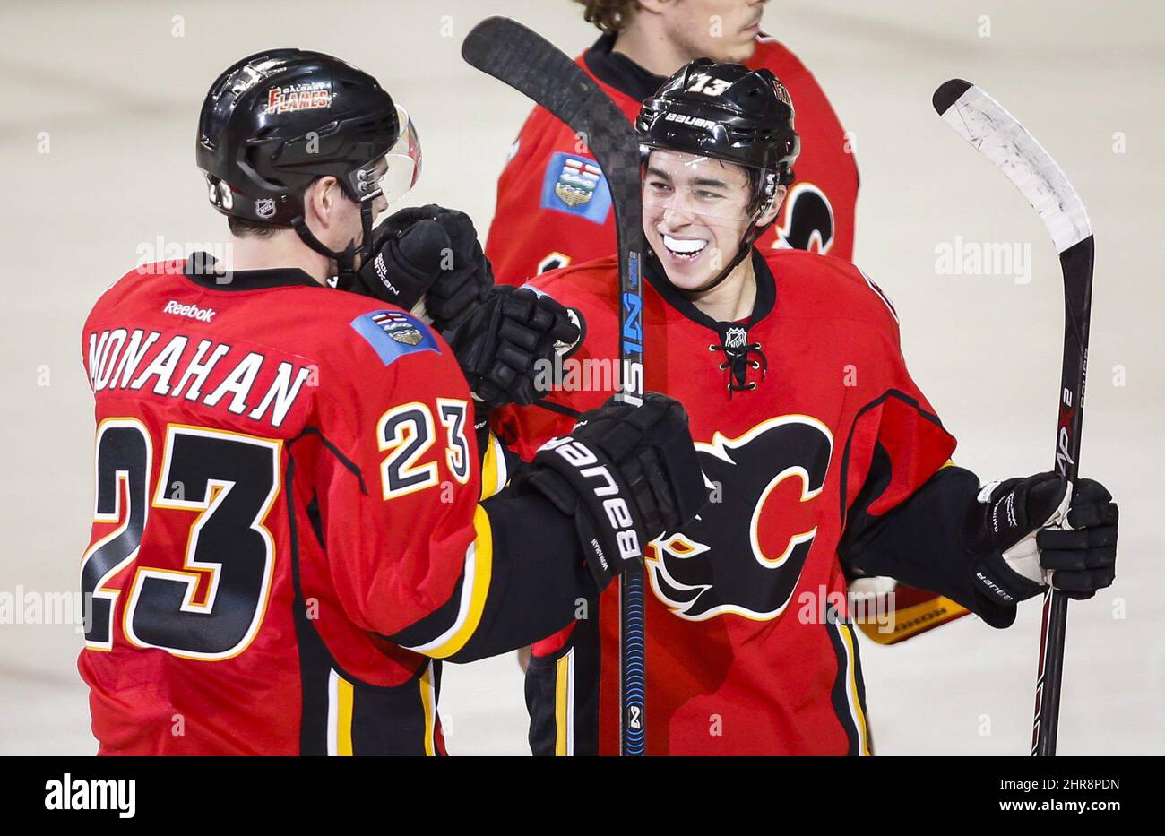 Calgary Flames' Sean Monahan, left, celebrates his game-winning goal ...