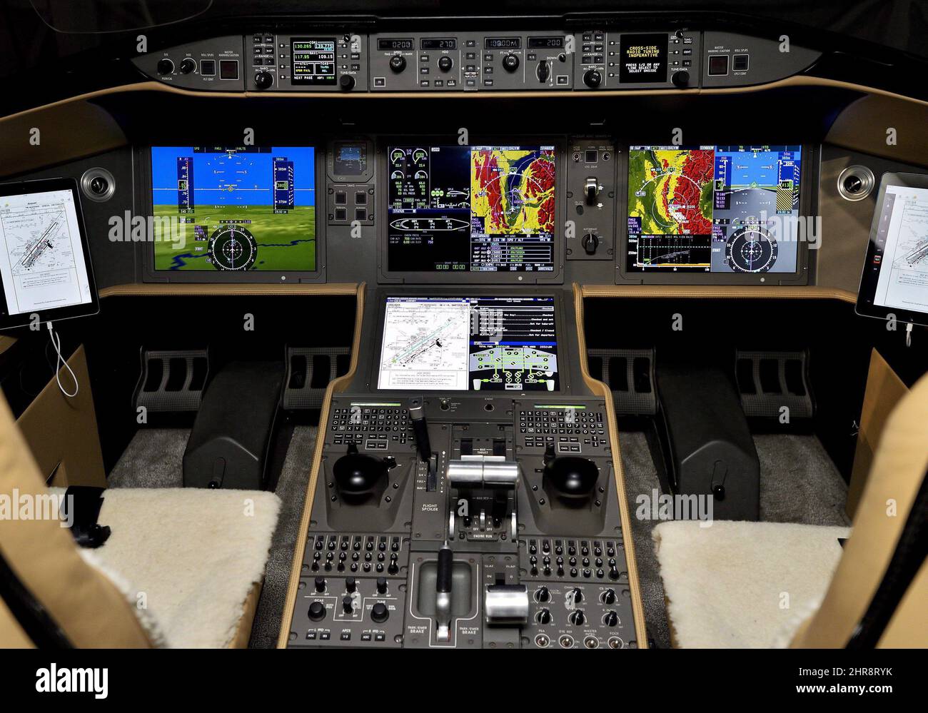 Digital instrumentation screens adorn the cockpit of a Bombardier ...