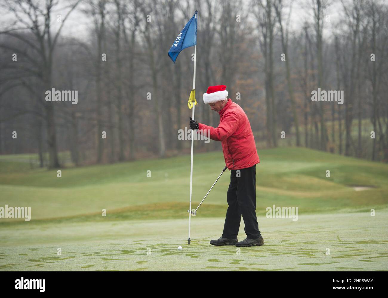 Gary Laughlin putts out on the 15th green at Lionhead Golf & Country ...