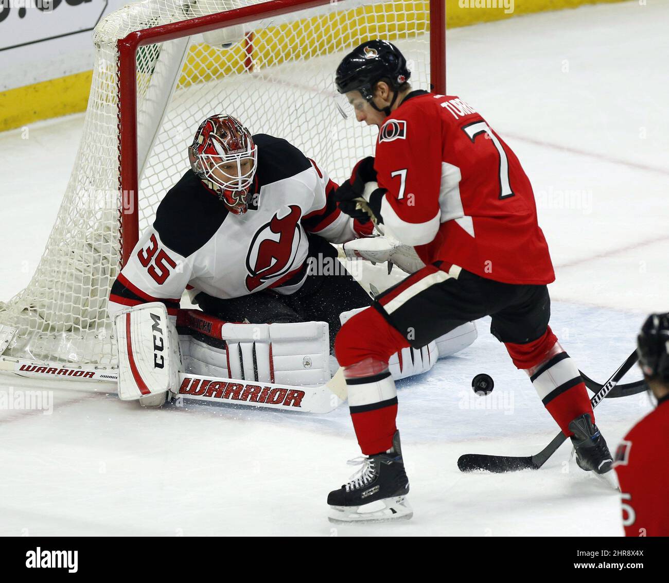 New Jersey Devils goaltender Cory Schneider (35) keeps eyes on the puck ...