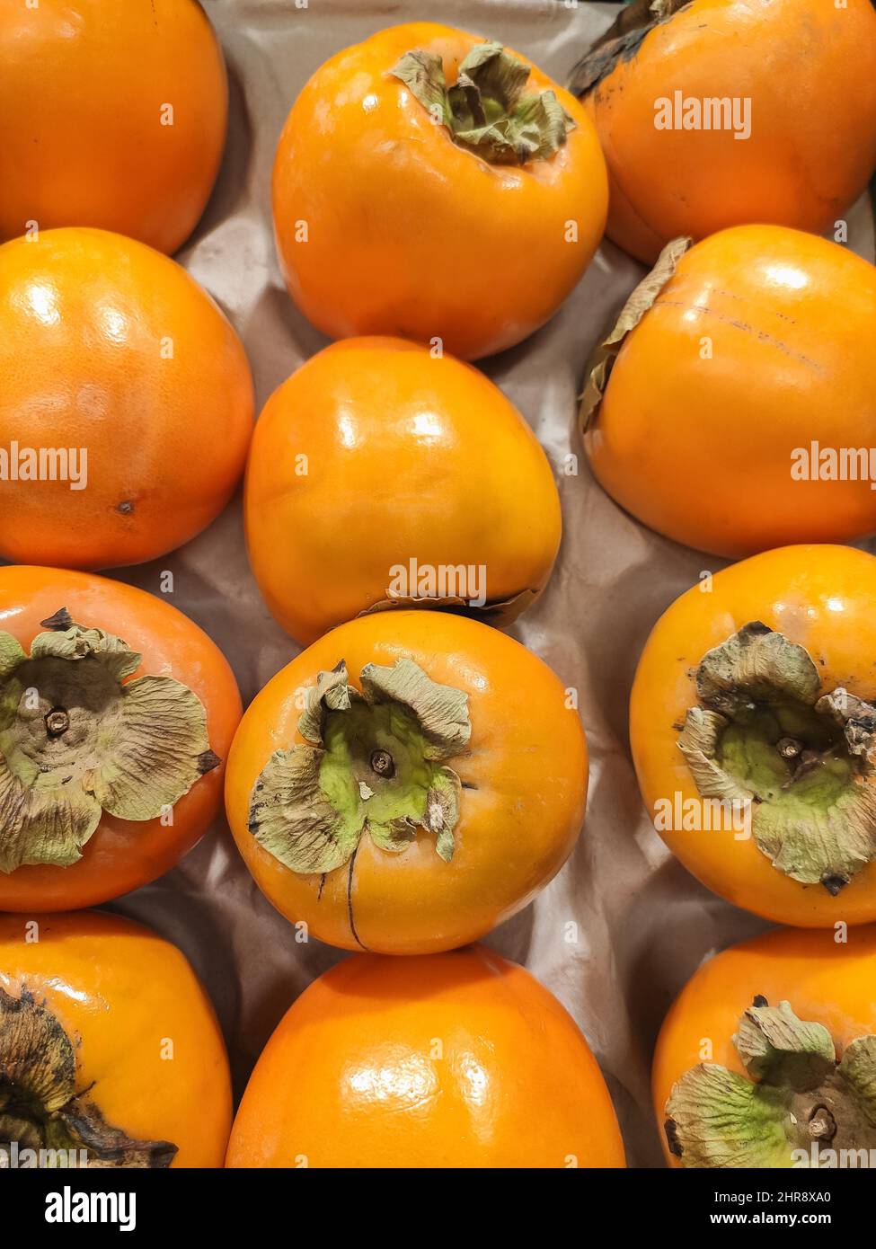 Fresh orange Persimon fruit .Kaki fruits on market Stock Photo - Alamy