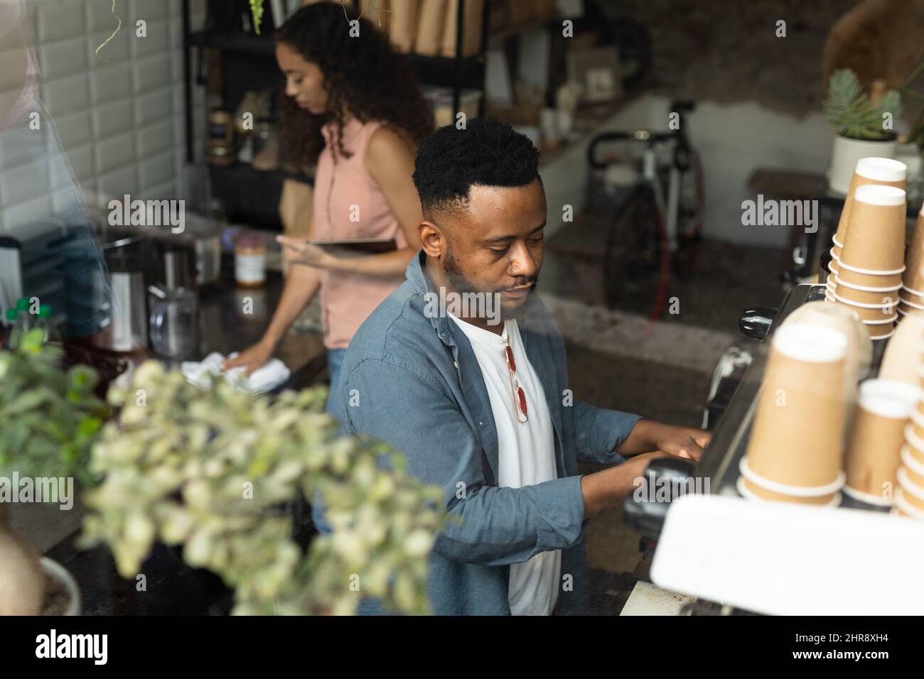 African american young baristas working together in coffee shop Stock ...