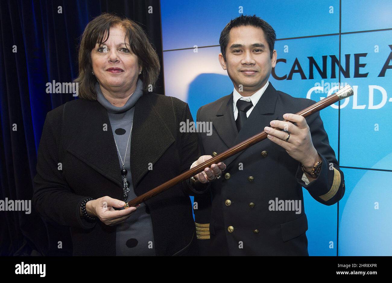 Captain Jun Eric Aljo Dalipe, master of the Vigorous smiles as he holds ...