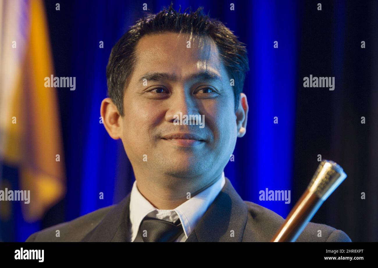 Captain Jun Eric Aljo Dalipe, master of the Vigorous smiles as he holds ...