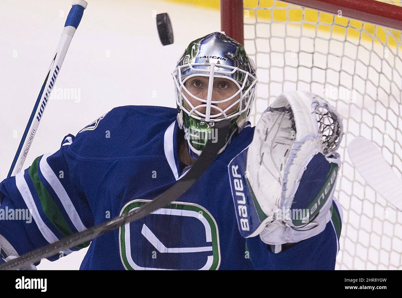 Vancouver Canucks goalie Jacob Markstrom (25) keeps his eye on the puck ...