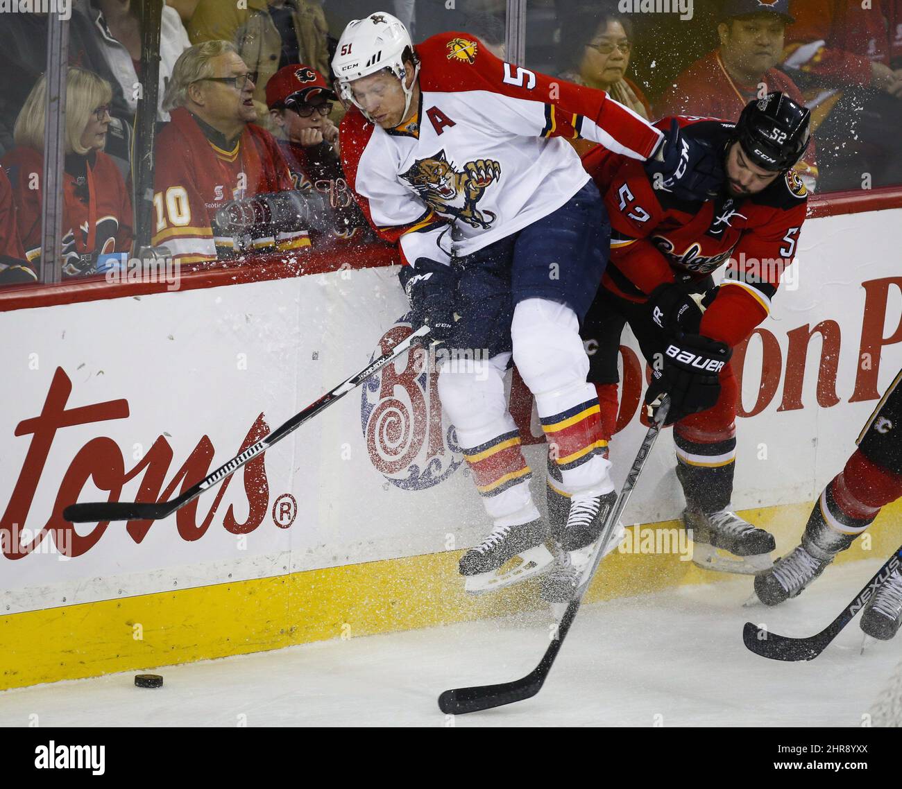 Florida Panthers' Brian Campbell, left, checks Calgary Flames' Brandon ...