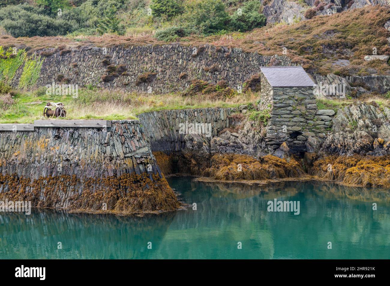 Vertically aligned stone quay wall at Amlwch harbour Anglesey Stock ...
