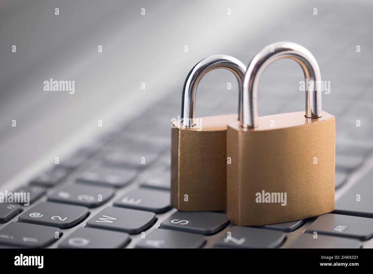 Security concept with two metal padlocks on computer keyboard Stock ...