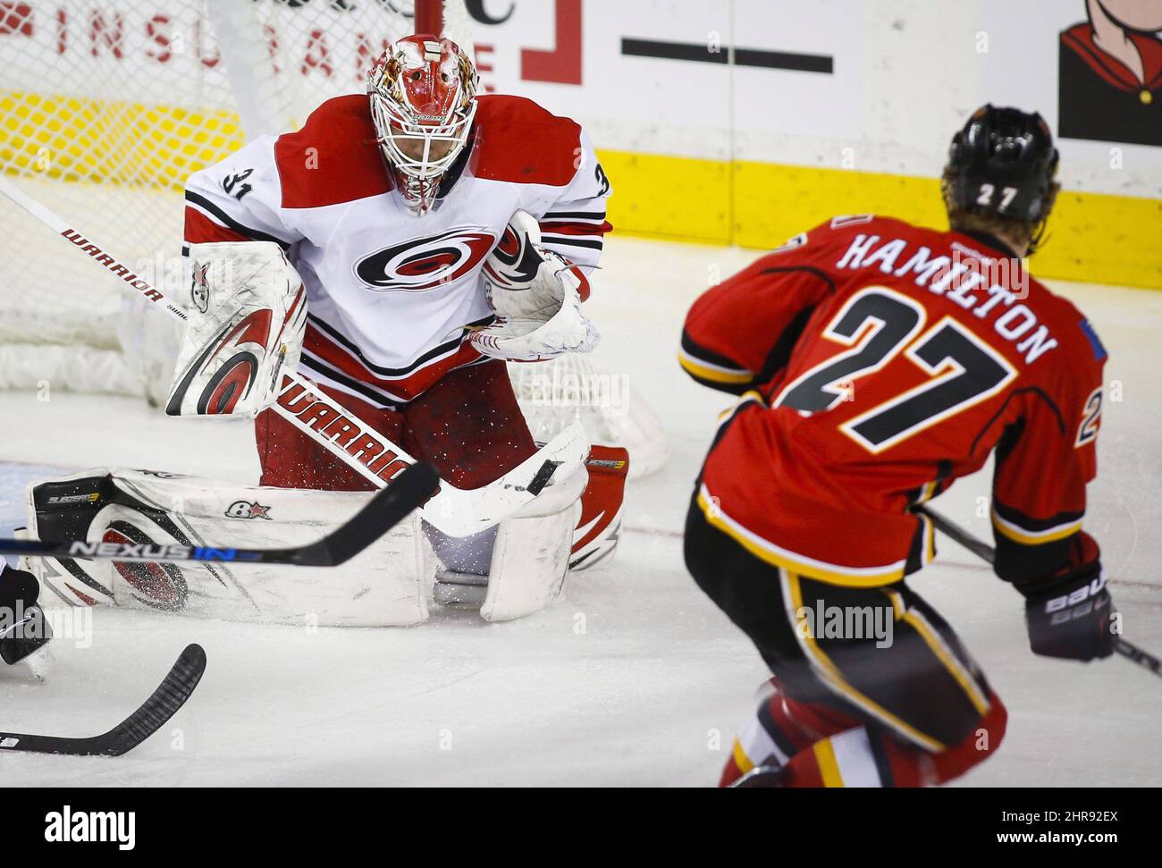 Carolina Hurricanes goalie Eddie Lack, left, of Sweden, stops a shot ...