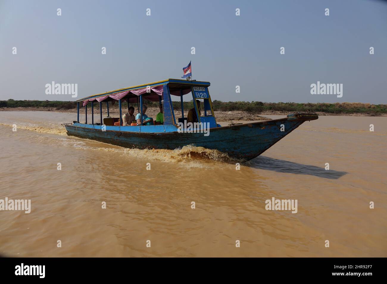 Siem Reap, Cambodia, Crusing Lake Tonle Sap in a colourful wooden motor ...