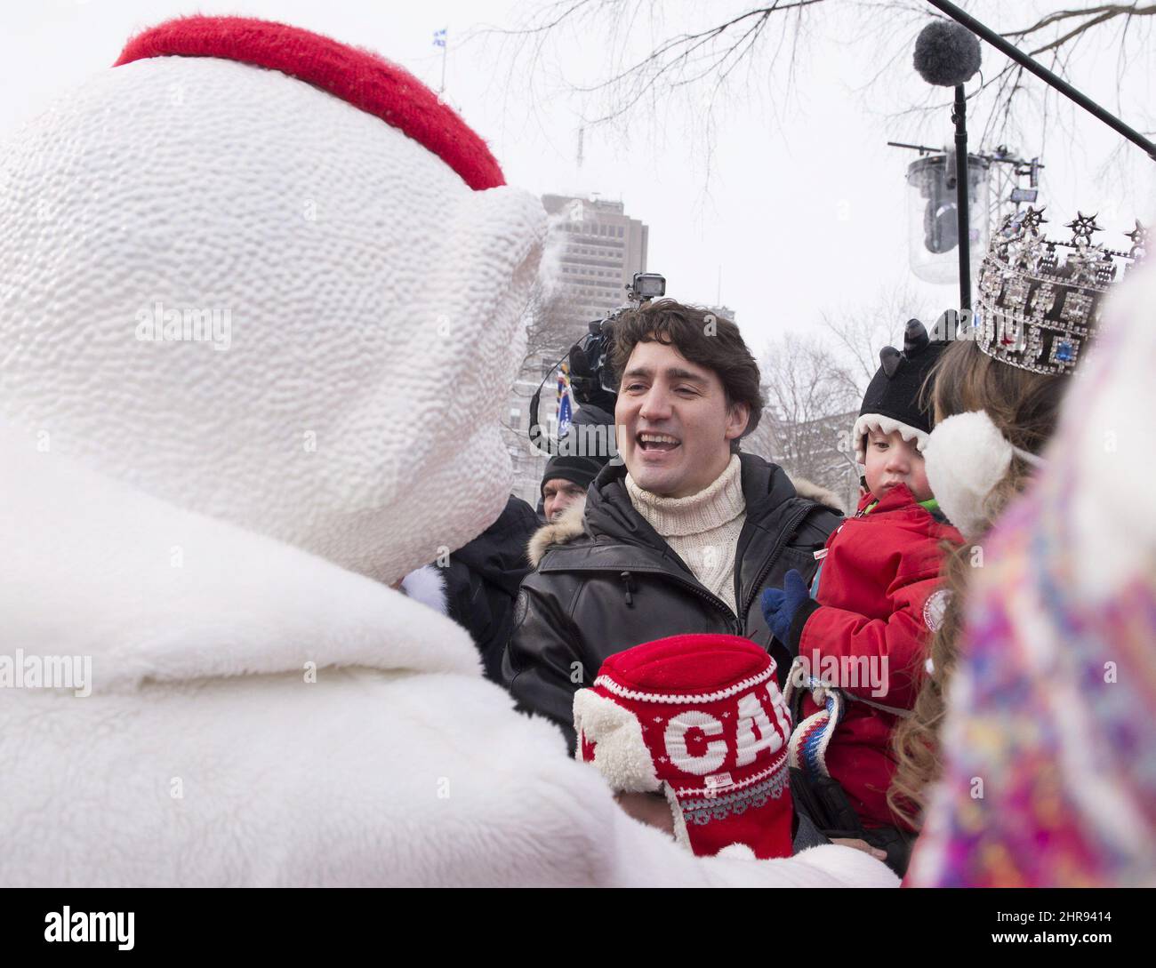Prime Minister Justin Trudeau is greeted by Bonhomme Carnaval as he ...