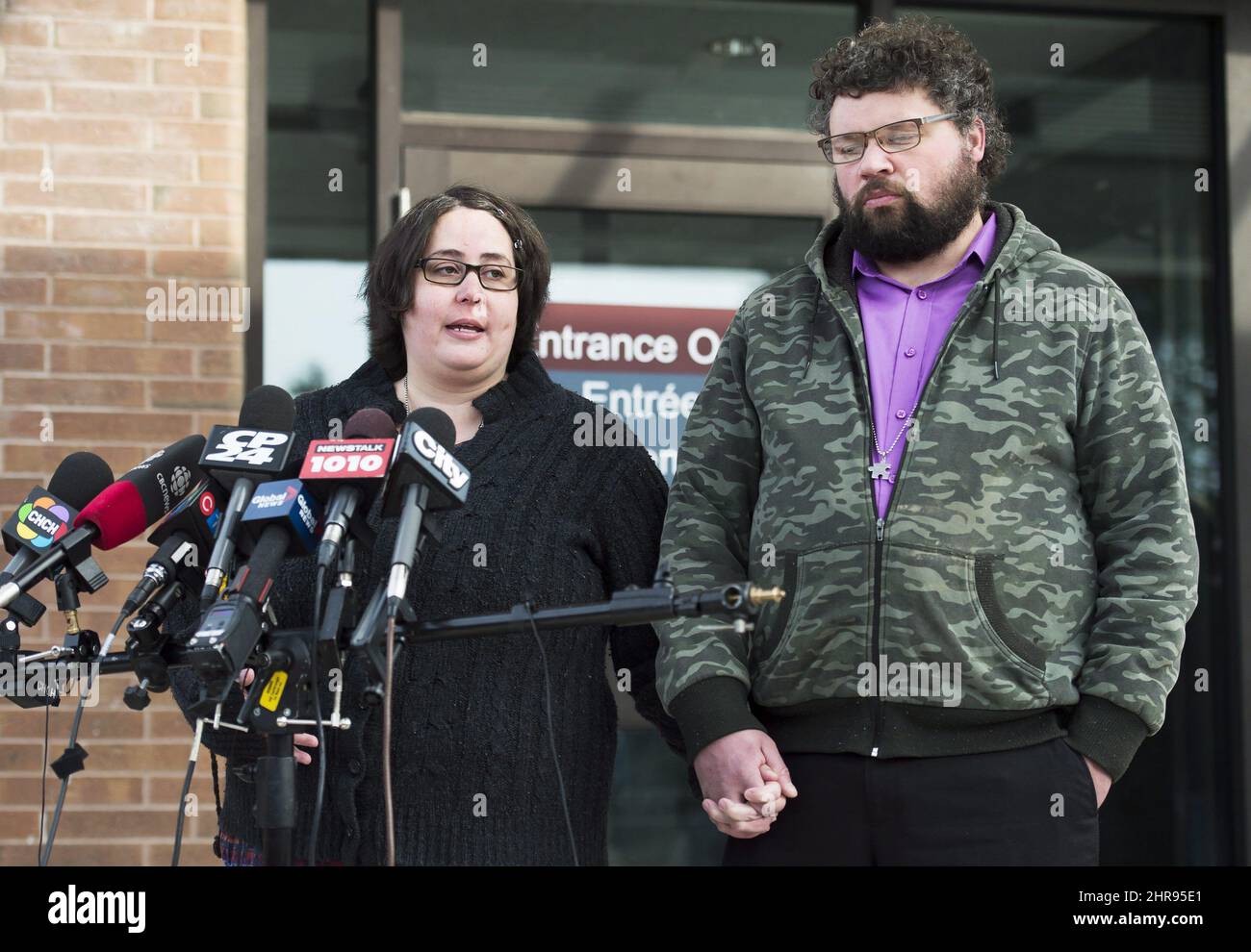 Jennifer Neville-Lake and her husband Edward speak to the media outside ...