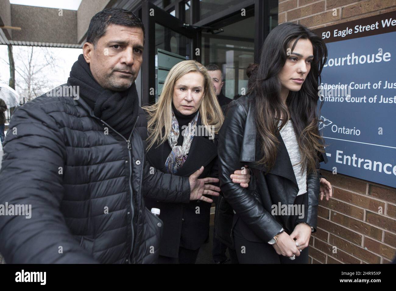 Marco Muzzo's mother Dawn Muzzo (centre) and fiancee Taryn Hampton ...