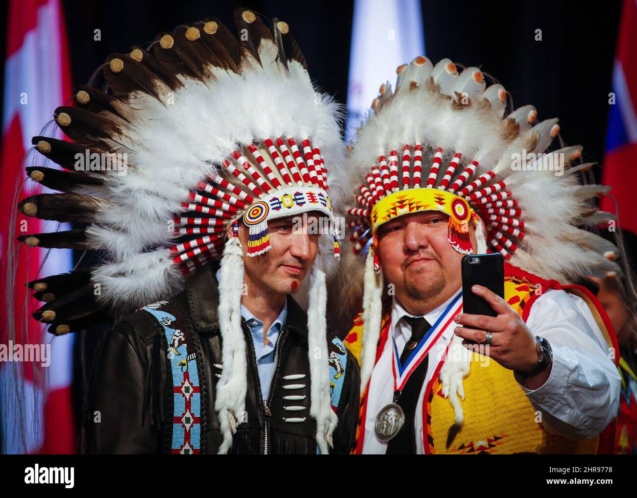 Prime Minister Justin Trudeau, left, poses for a selfie with an elder ...