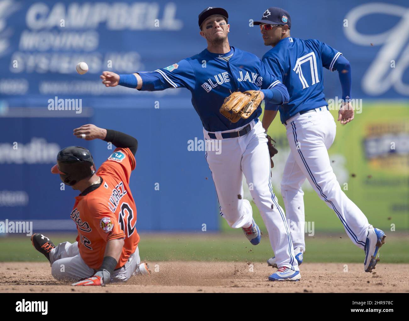 Toronto Blue Jays short stop Troy Tulowitzki turns a double play on ...
