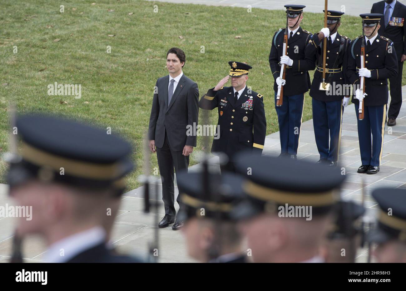 Prime Minister Justin Trudeau stands for the national anthems at Tomb ...