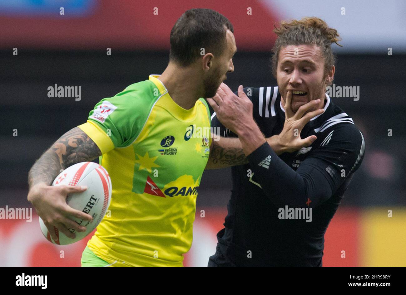 New Zealand's Gillies Kaka, right, tackles Australia's Quade Cooper ...