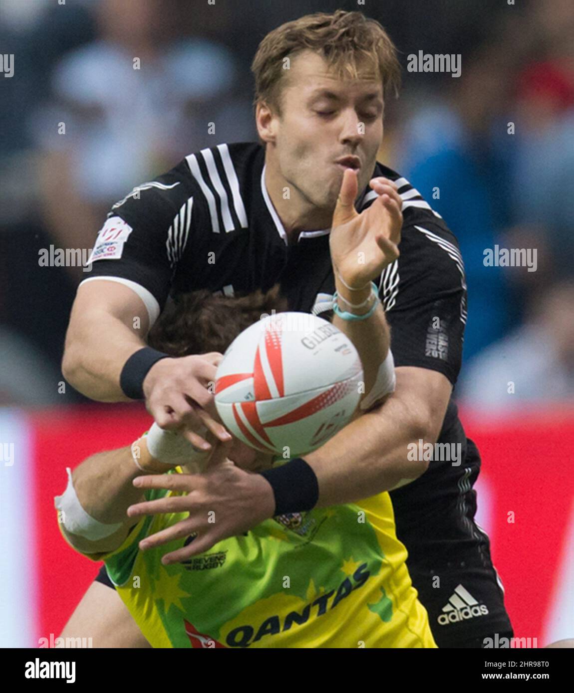 New Zealand's Tim Mikkelson, back, knocks the ball away from Australia ...
