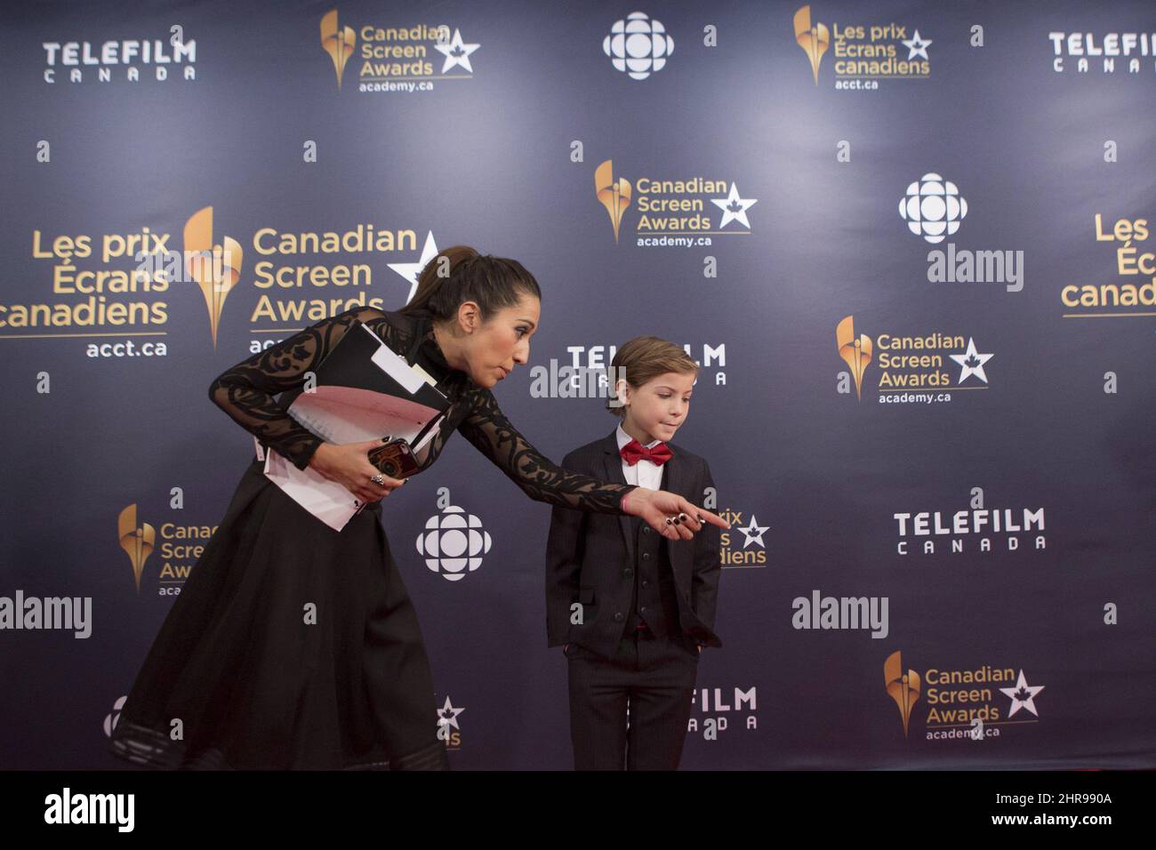 Jacob Tremblay is shown his mark by a publicist as he arrives on the ...