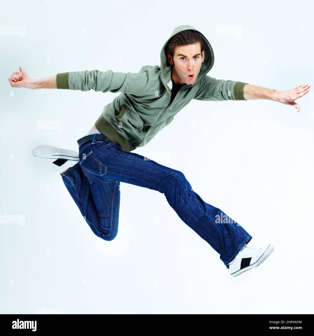 Free and fun-loving in the air. Portrait of a young man posing while ...