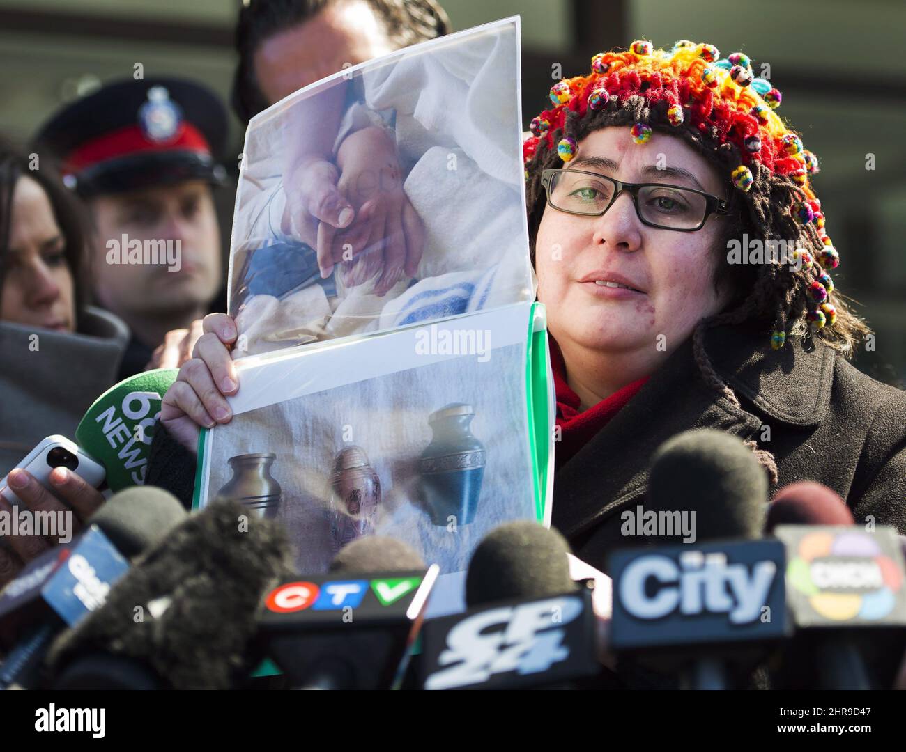 Jennifer Neville-Lake cries as she shows photographs of her three ...