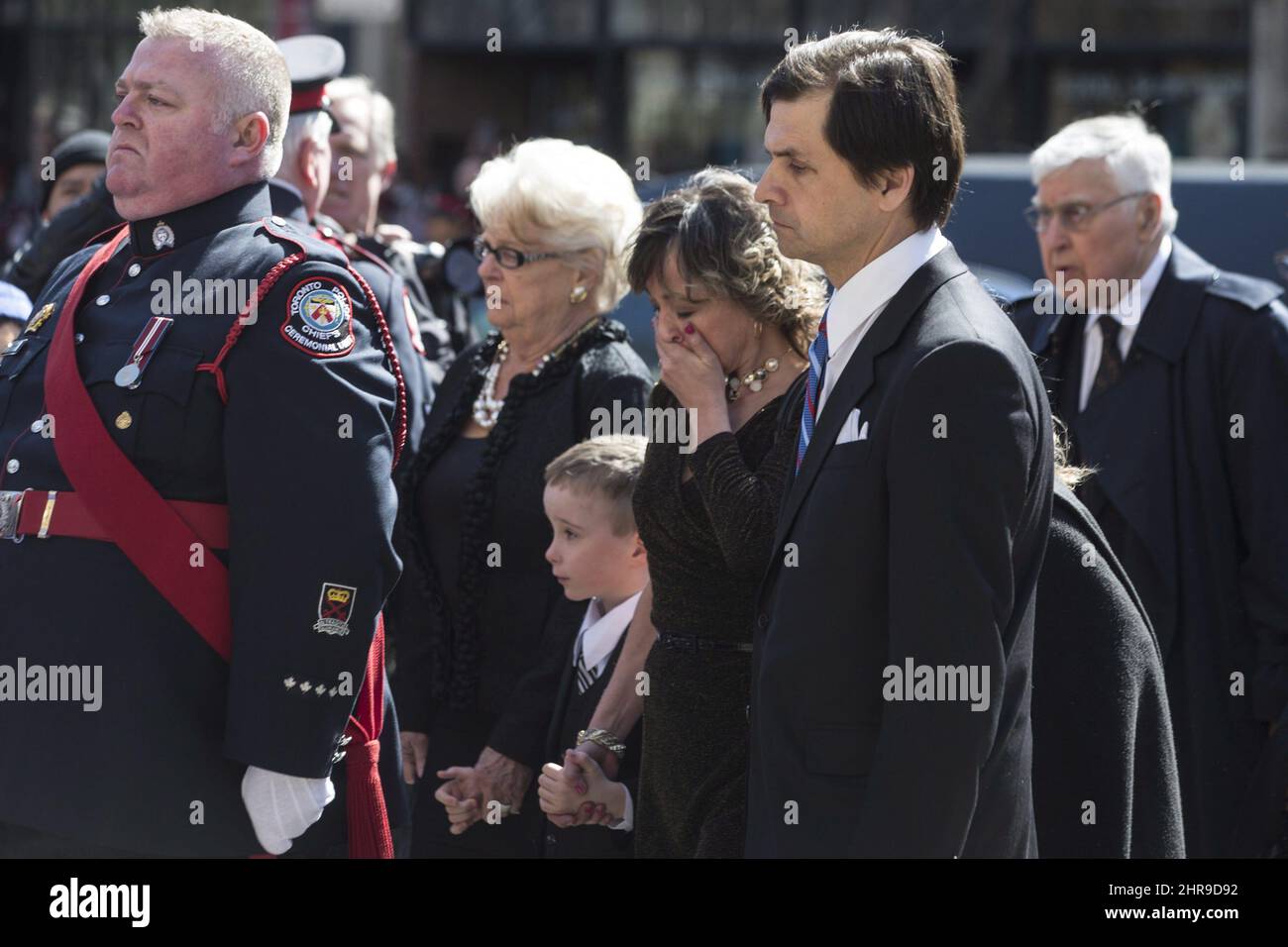 Widow Renata Ford (centre) weeps as she arrives at Toronto's St. James ...