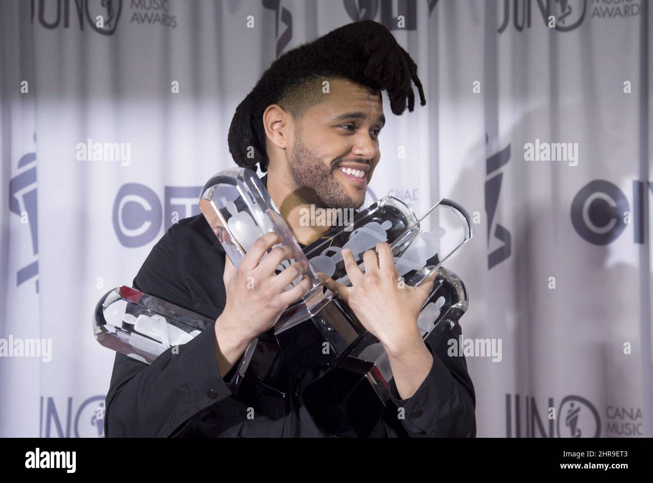 The Weeknd holds his five Juno trophies at the Juno Awards Gala in ...