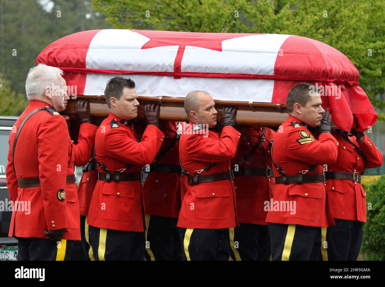 RCMP pallbearers carry the casket of Const. Sarah Beckett during a ...