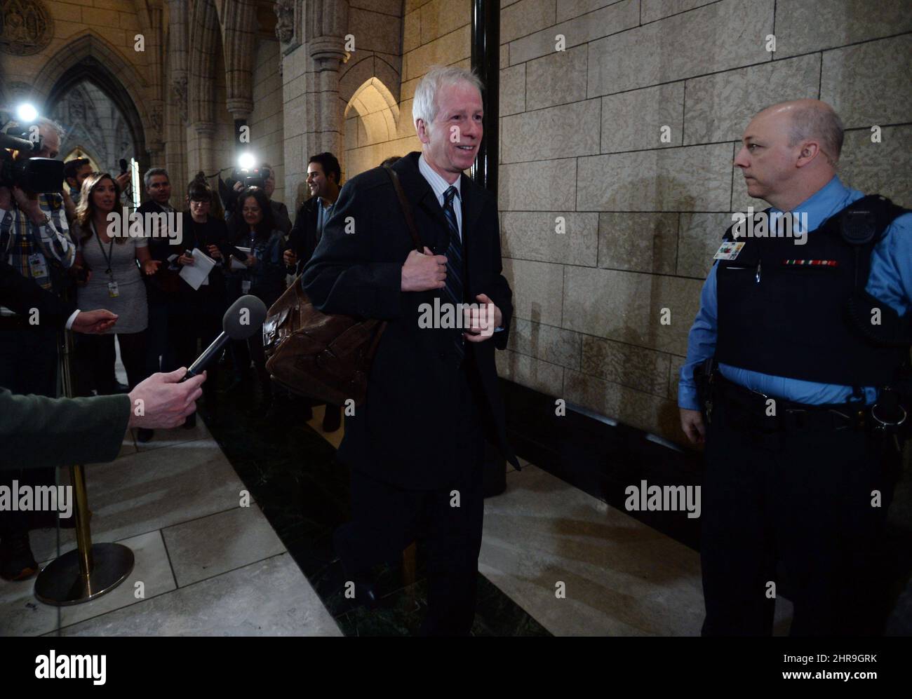 Foreign Affairs Minister Stephane Dion makes his way to a Liberal ...