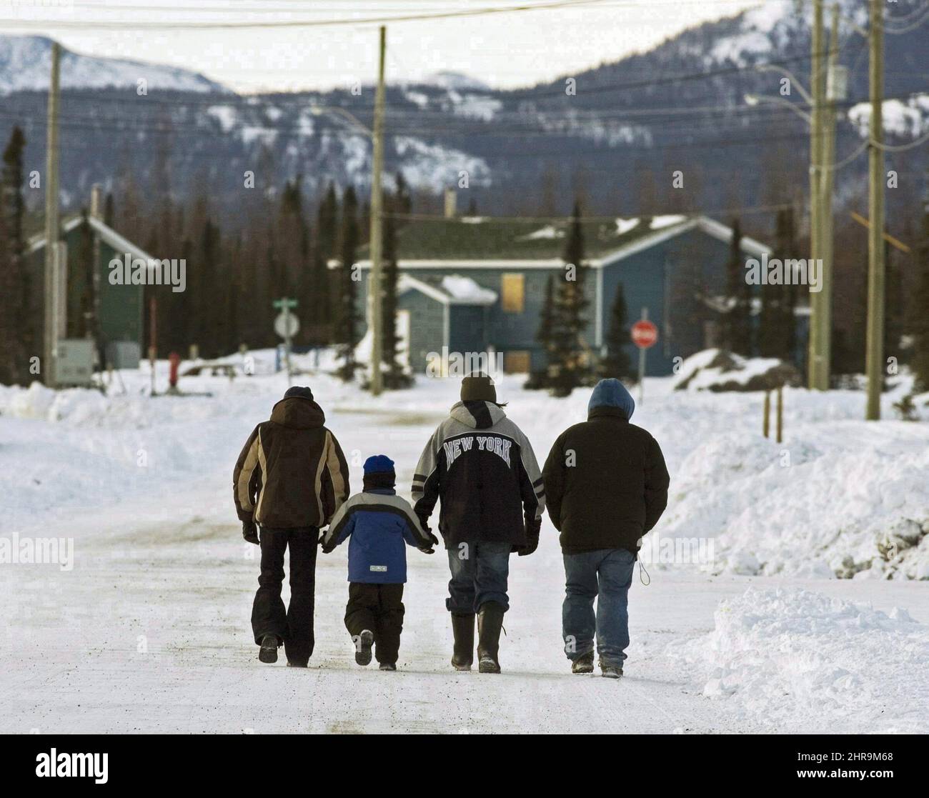Residents walk in the northern Labrador community of Natuashish, N.L ...