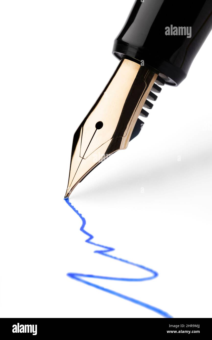 Traditional golden fountain pen writing with blue ink close up Stock ...