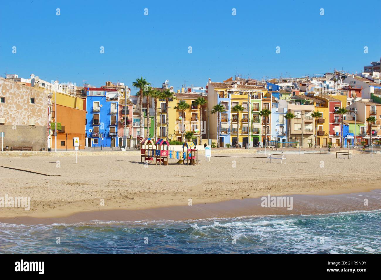 Summer View Of The Sandy Beach And The Colorful Houses In Villajoyosa Summer View Of The Sandy Beach And The Colorful Houses In Villajoyosa