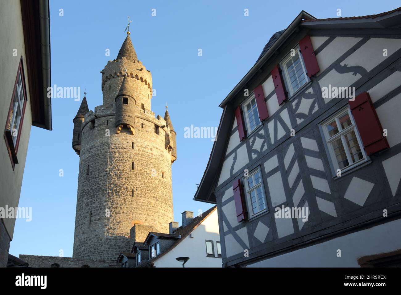 Half-timbered house and historic Adolfsturm, Friedberg, Hesse, Germany ...