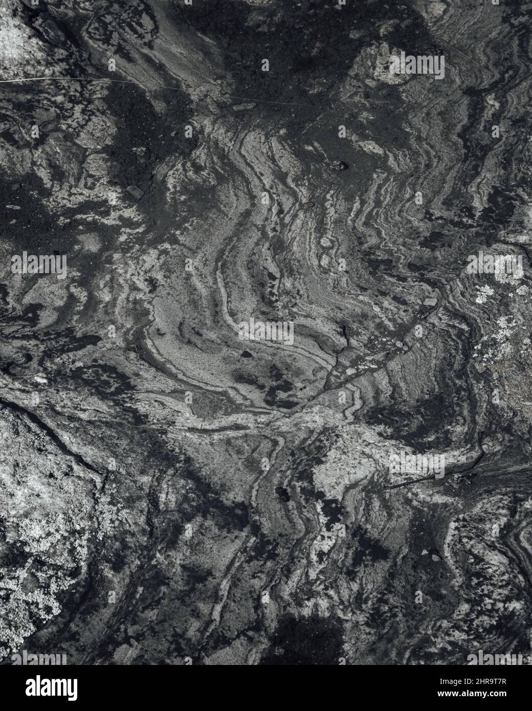 Closeup of a wavy gray granite stone, for background Stock Photo - Alamy