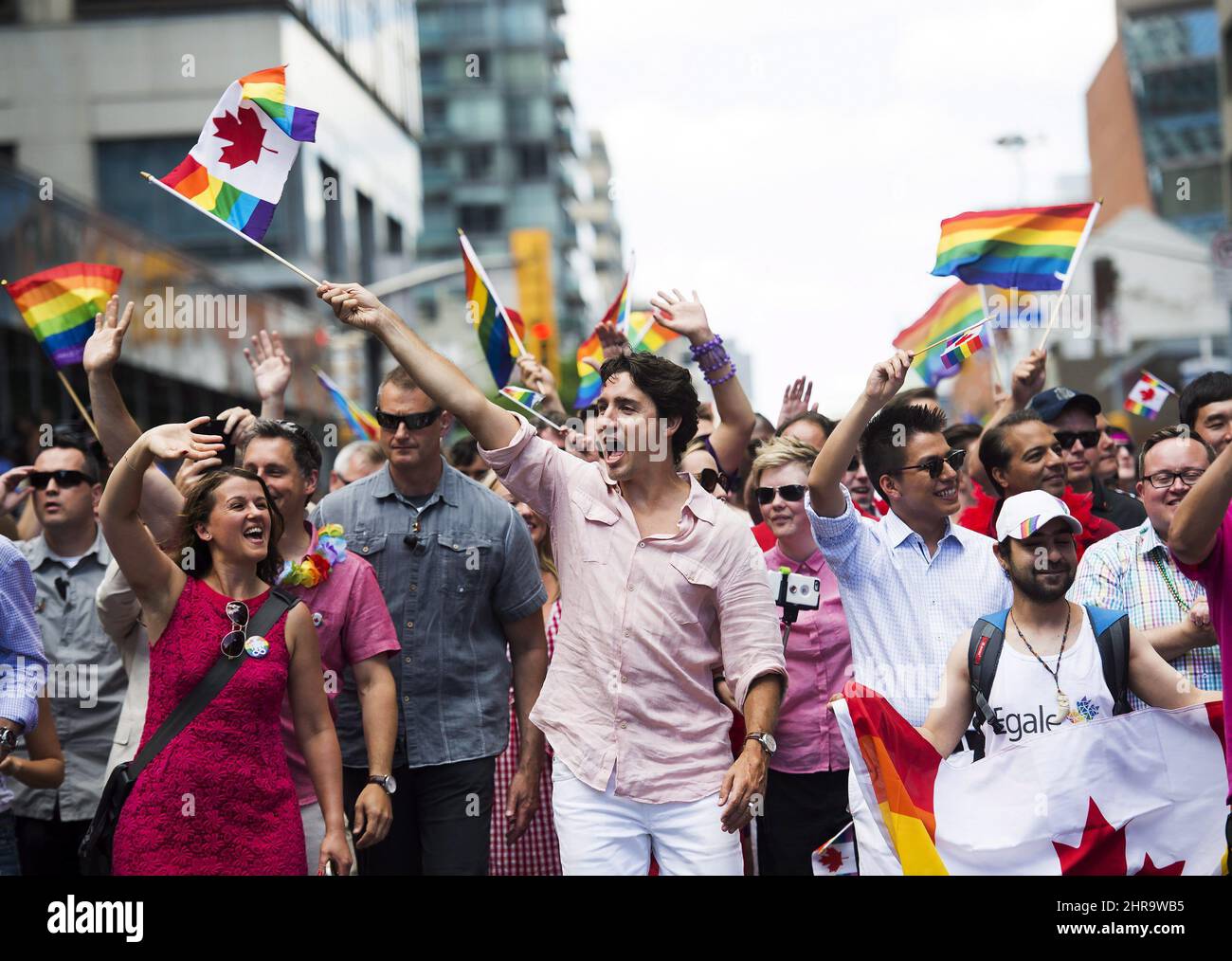 Prime Minister Justin Trudeau waves a flag as he takes part in the ...