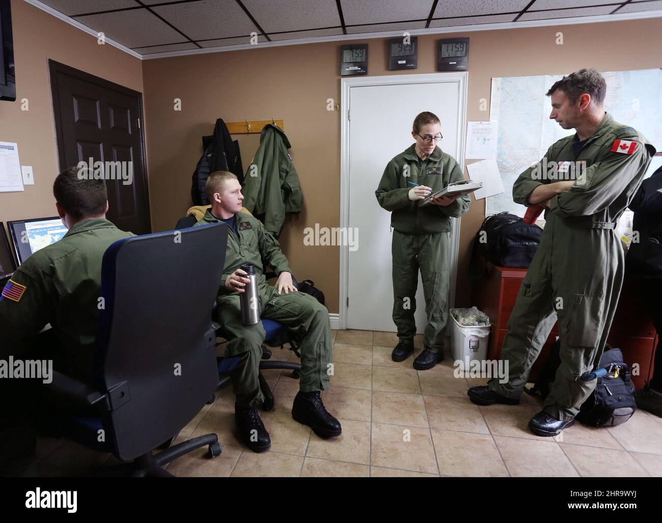 Members of the International Ice Patrol at the pre-flight weather ...